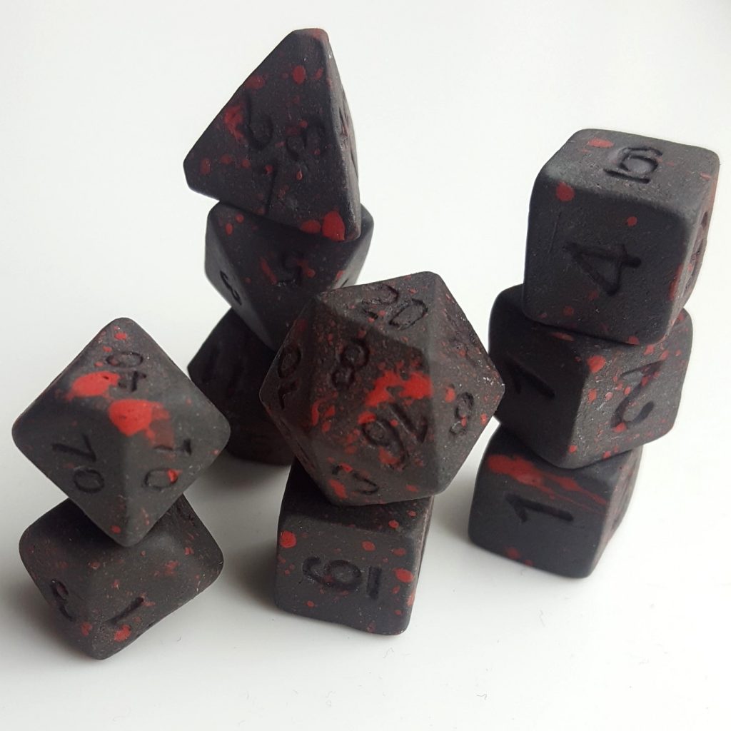 Unleash Your Game with Blood Splatter Ceramic Dice Set